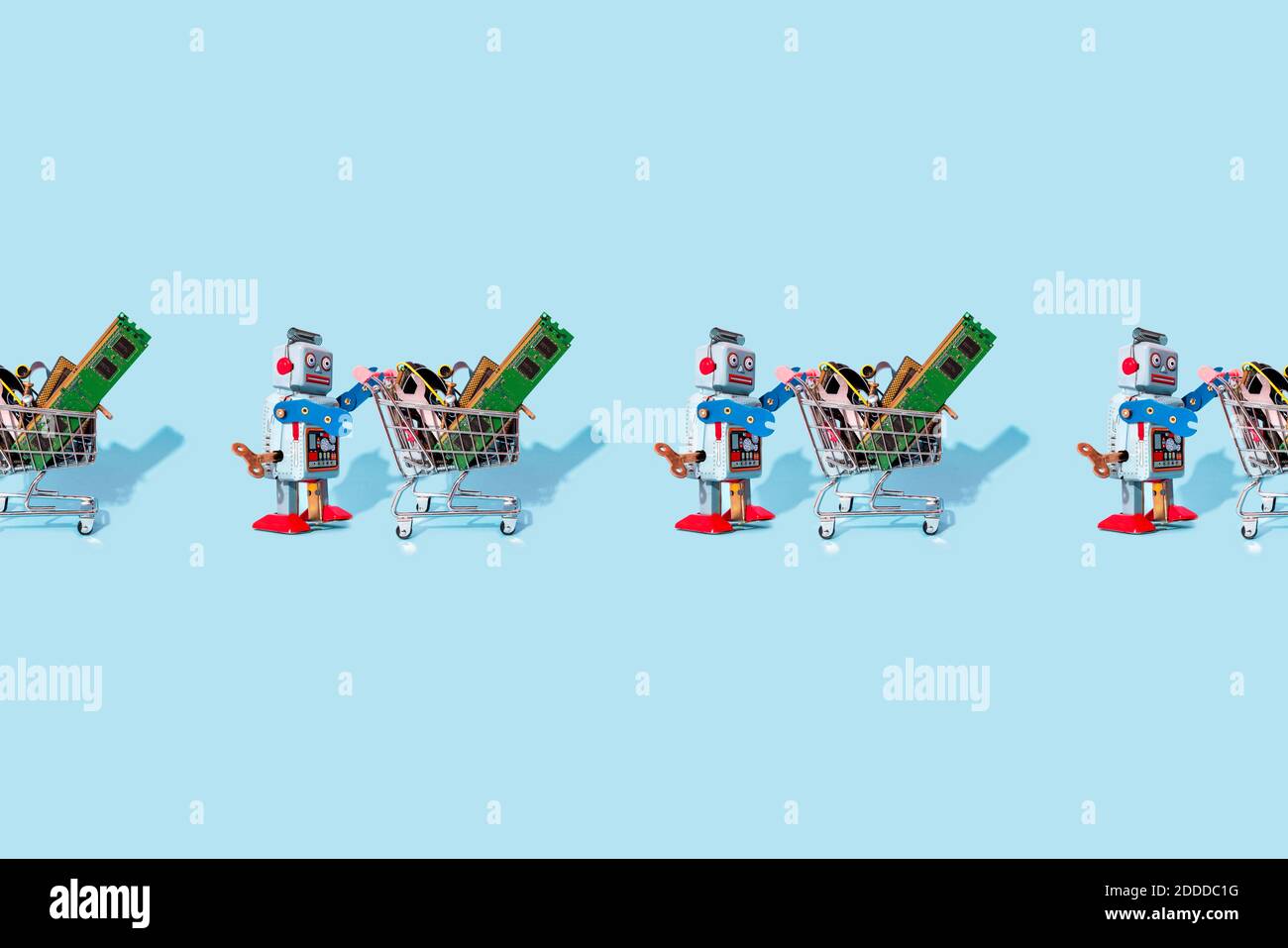 Studio shot of vintage robot toys pushing miniature shopping carts ...