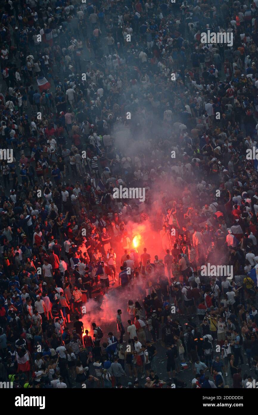 People celebrate on the Champs Elysees avenue after the final of the ...