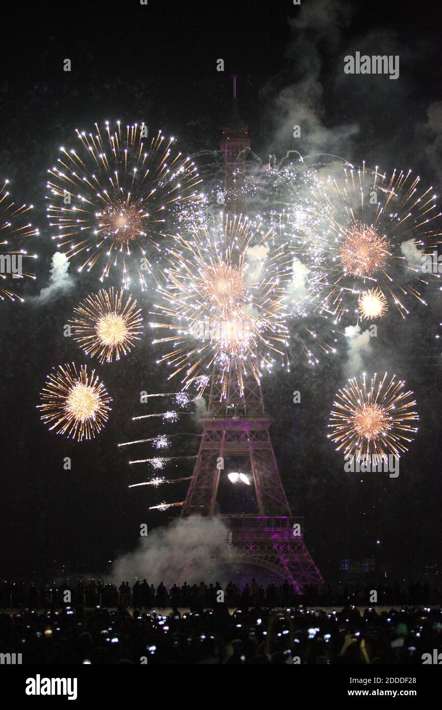 Fireworks explode from the Eiffel Tower during the annual Bastille Day celebration, on July 14 ...