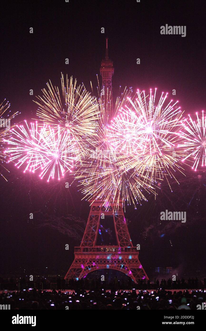Fireworks explode from the Eiffel Tower during the annual Bastille Day ...