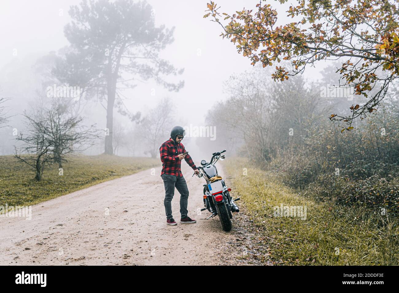 Man standing on motorcycle hi-res stock photography and images - Alamy