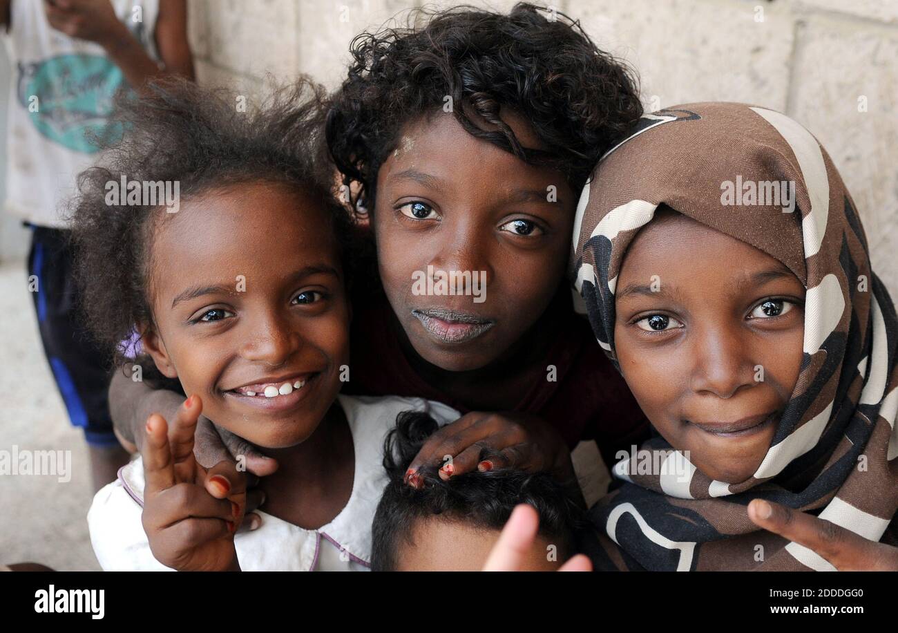 Yemeni internally displaced girls pose to be pictured at a school sat ...