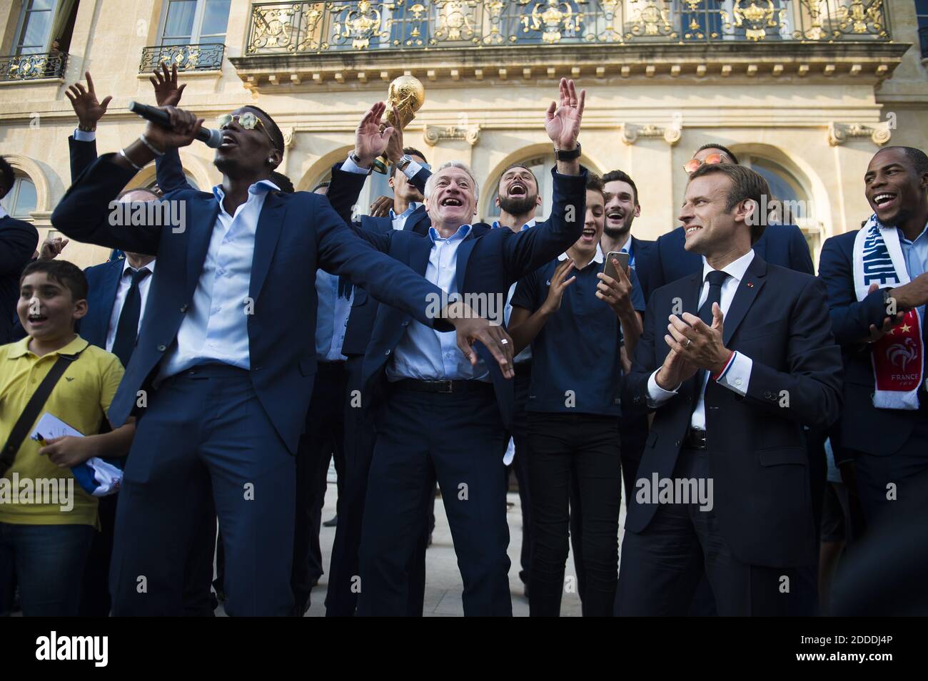 French President Emmanuel Macron (R) speaks next to France's coach ...
