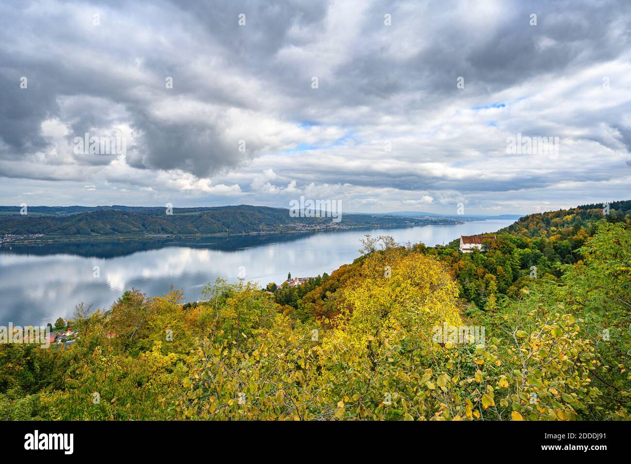 Clouds over Lake Constance ale lakeshore forest in autumn Stock Photo ...