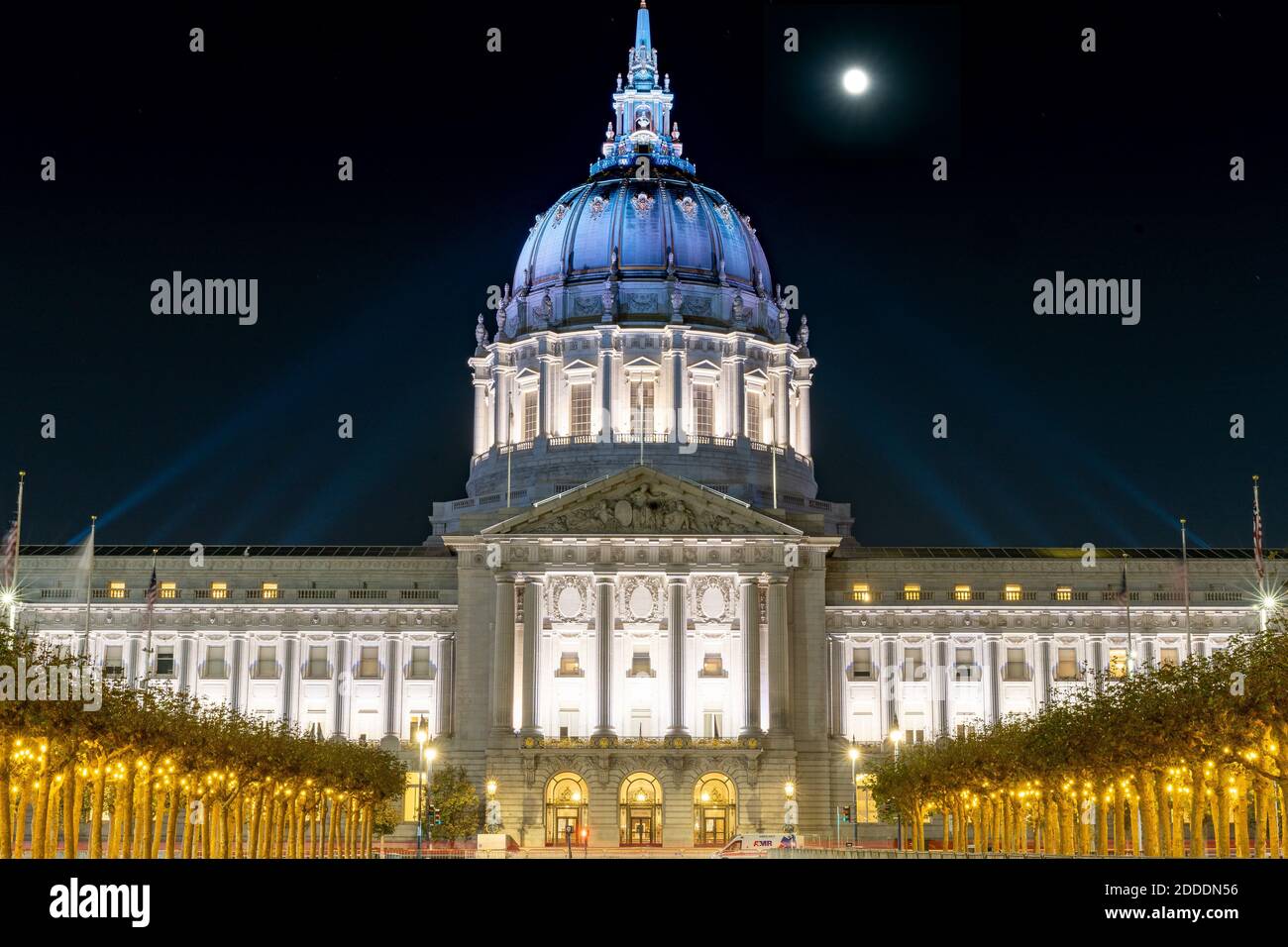 A well lit city government building on a full moon night Stock Photo ...