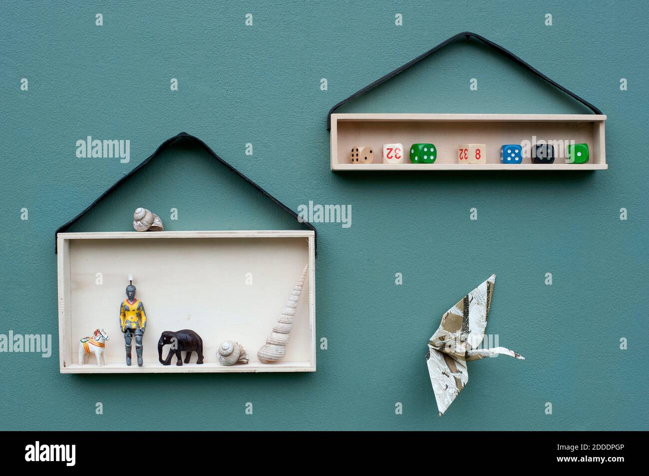 Toys on DIY shelves hanging on leather strips Stock Photo - Alamy