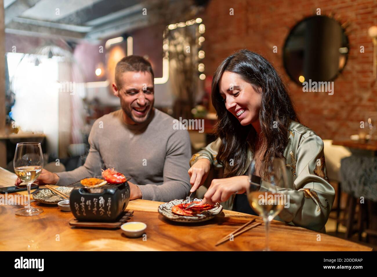 Two men eating table hi-res stock photography and images - Alamy