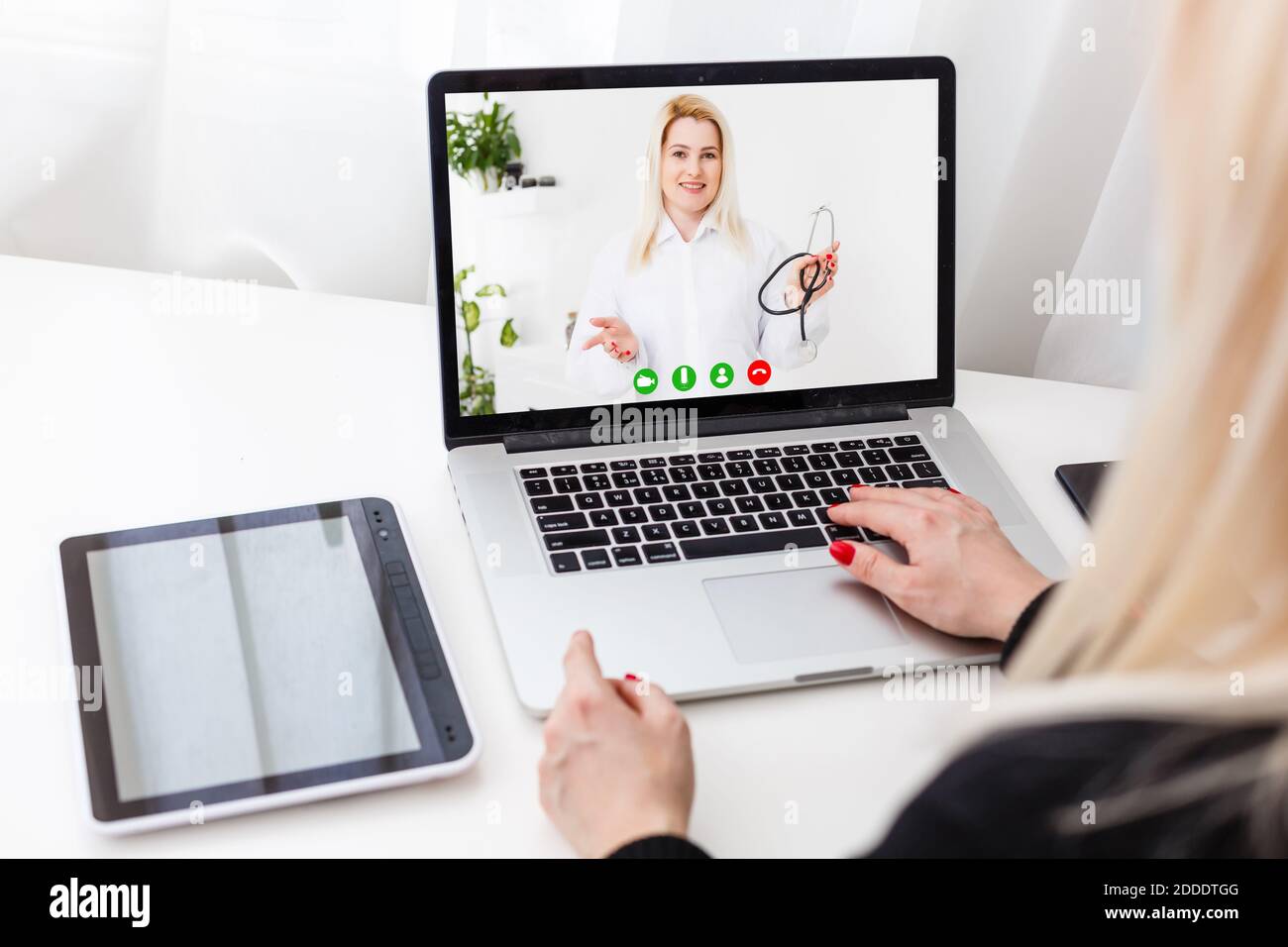 laptop with doctor on screen , online consultation Stock Photo - Alamy