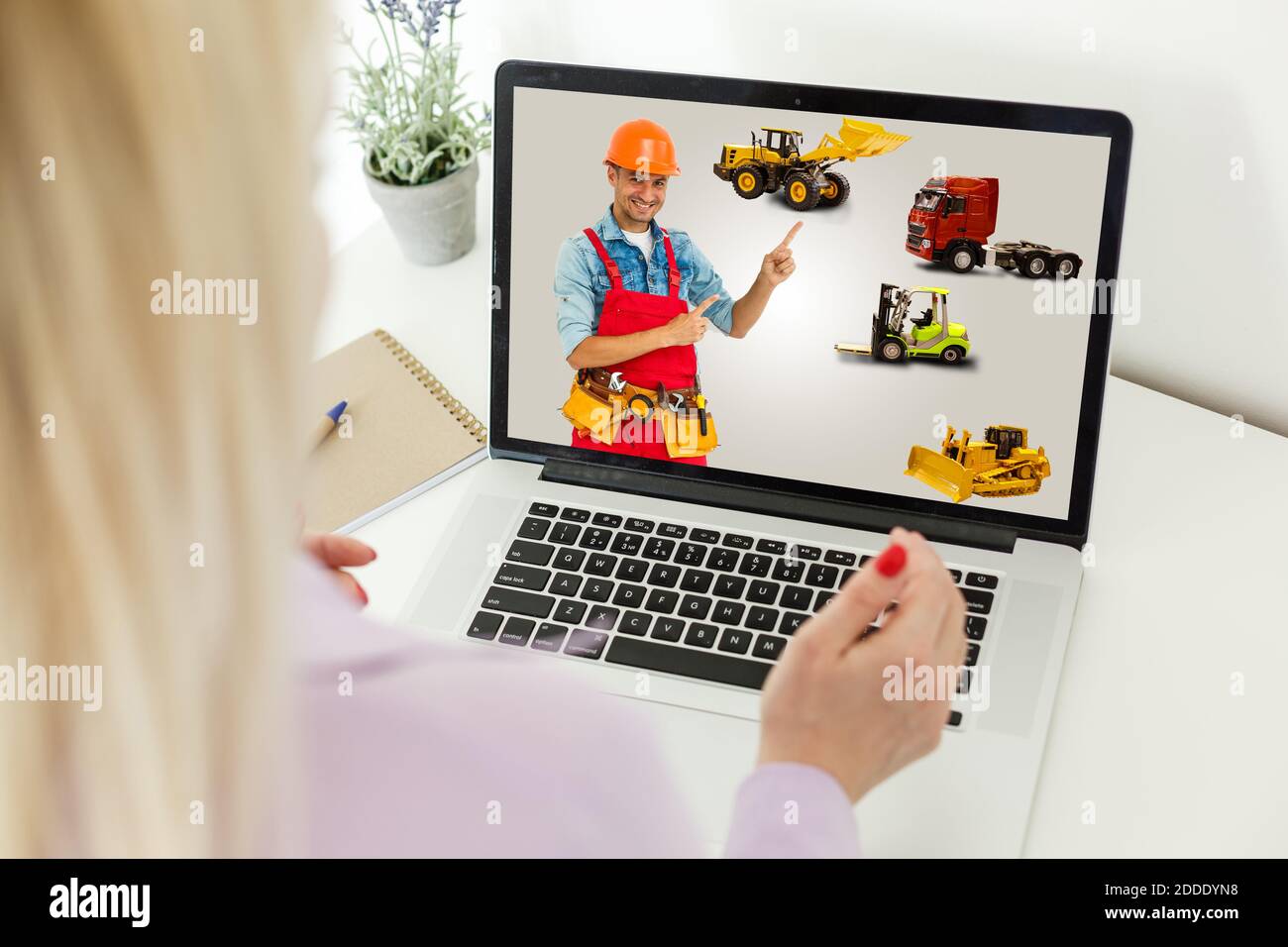 young manual worker displaying laptop over white background Stock Photo ...