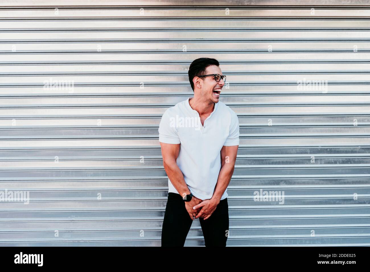Man Standing In Front Of Roller Shutter High Resolution Stock ...