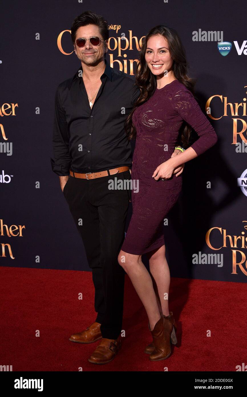 John Stamos, Caitlin McHugh attend the premiere of Disney's ...