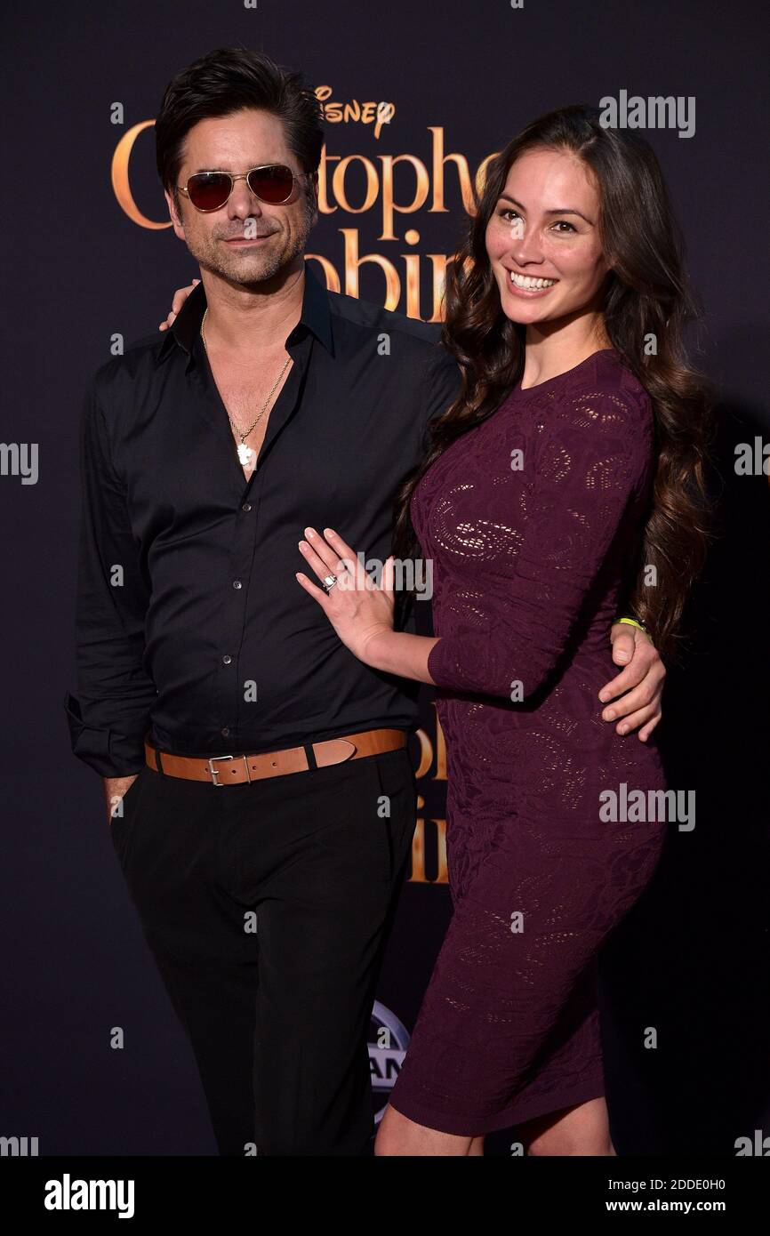 John Stamos, Caitlin McHugh attend the premiere of Disney's ...