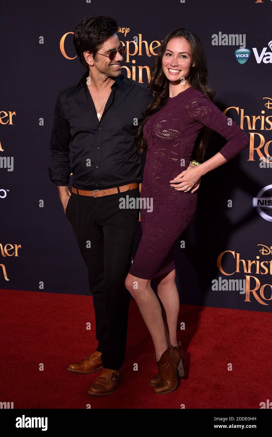 John Stamos, Caitlin McHugh attend the premiere of Disney's ...