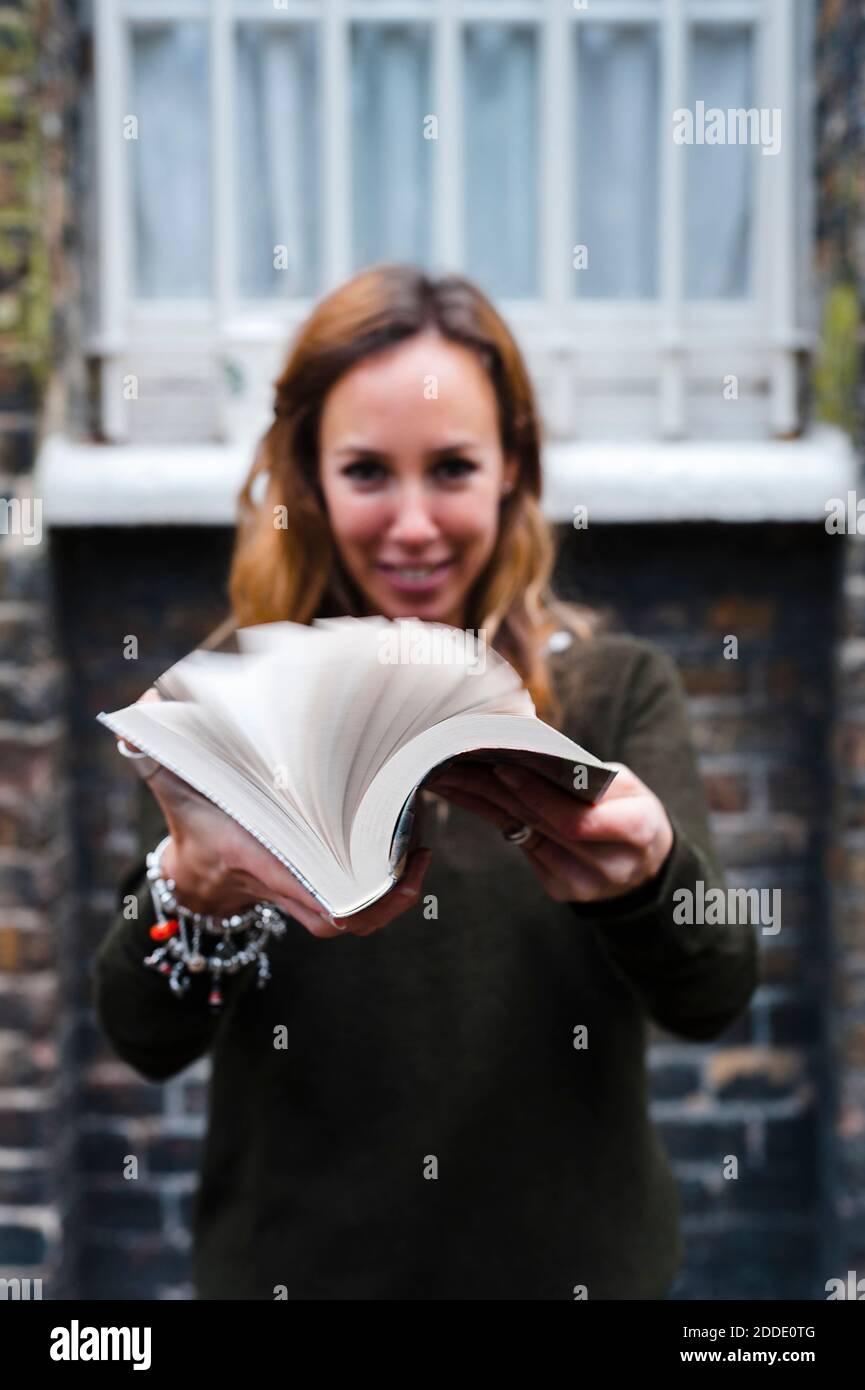 One woman flipping pages book hi-res stock photography and images - Alamy
