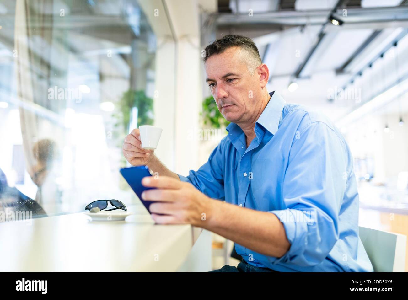 Attractive male using mobile hi-res stock photography and images - Alamy