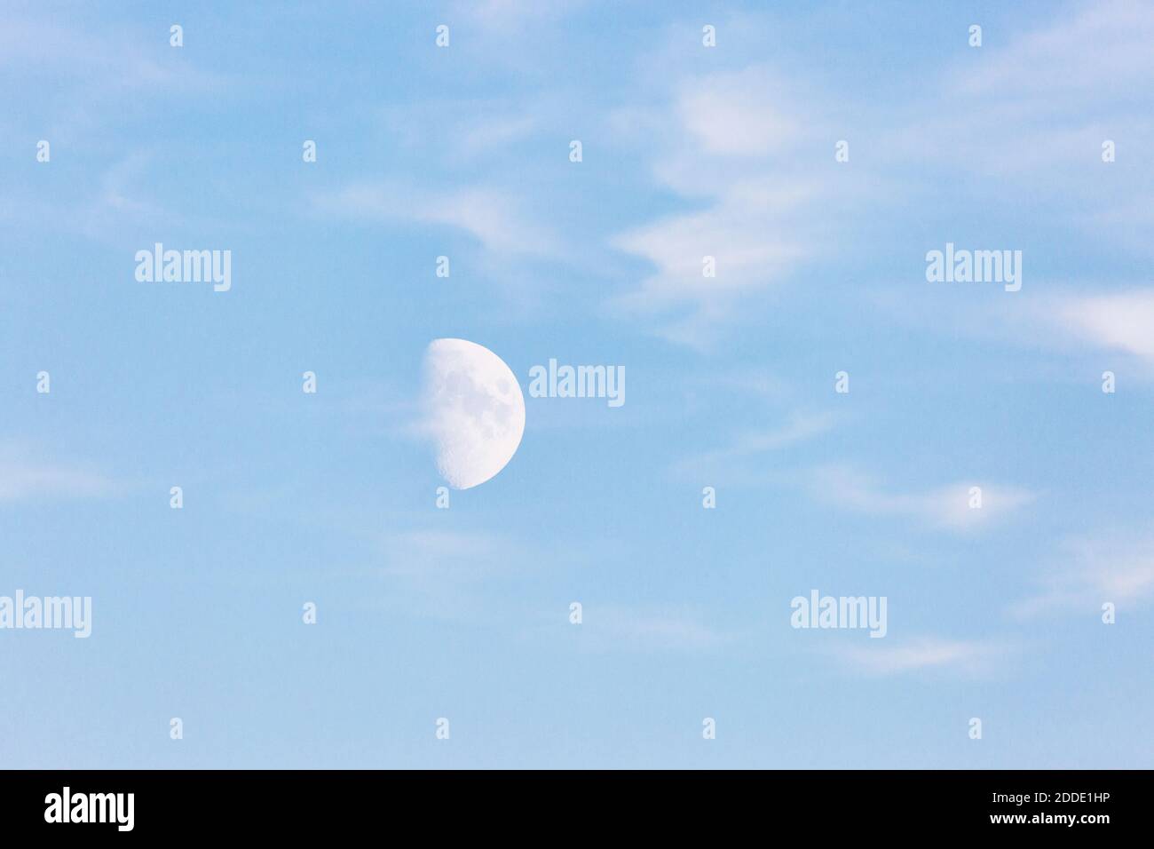 Daytime moon against pastel blue sky hi-res stock photography and ...