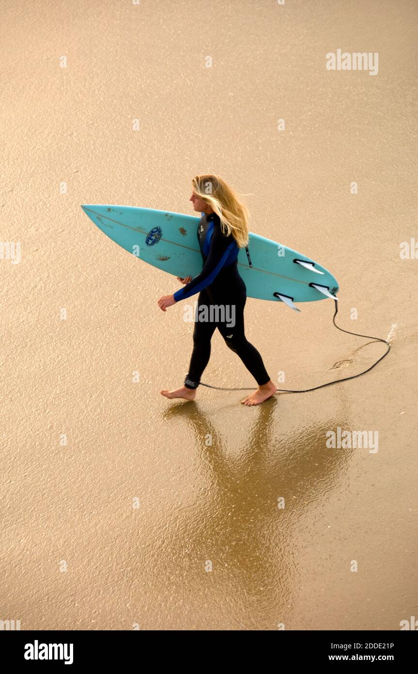 California surfer dude with board on beach Stock Photo - Alamy