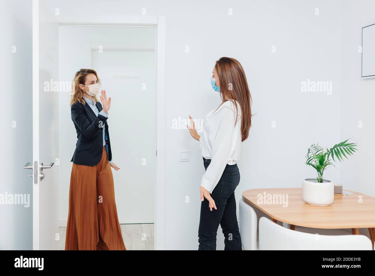 Waving door woman hi-res stock photography and images - Alamy