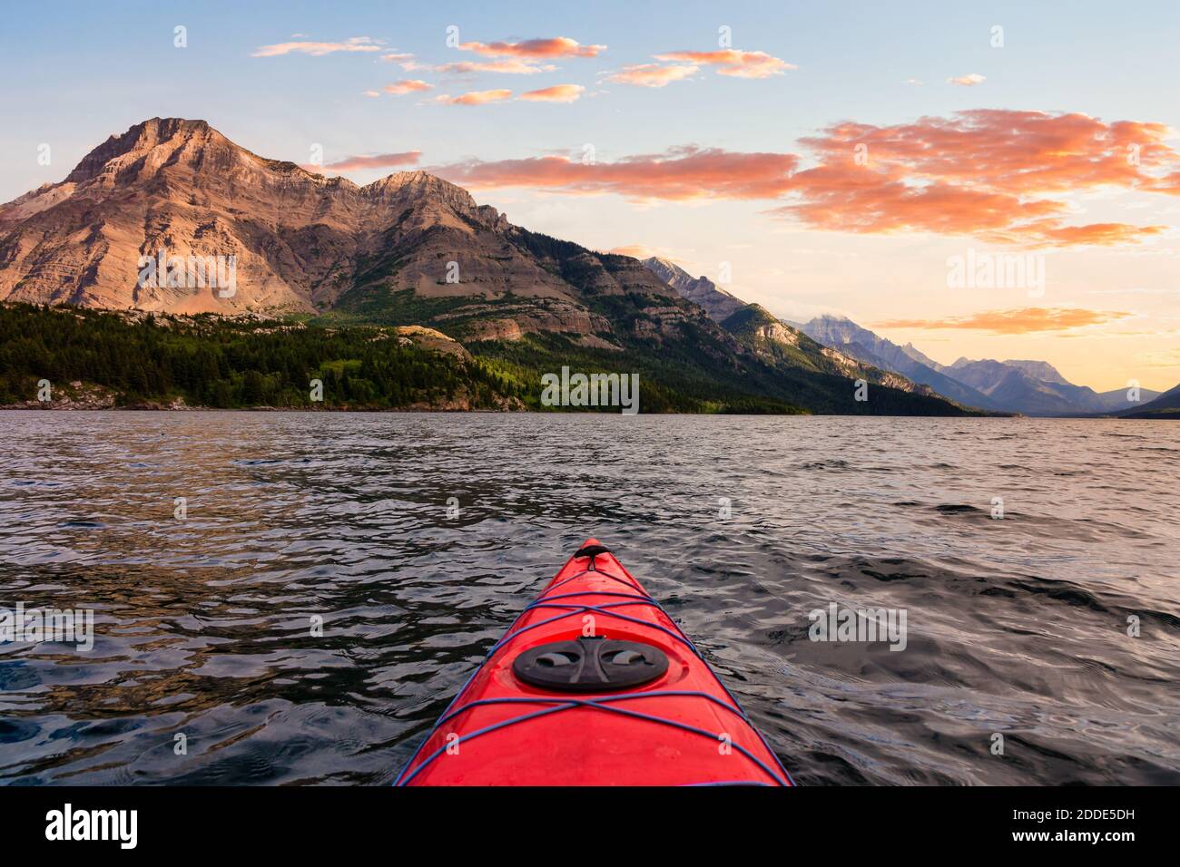 Kayaking in Glacier Lake surrounded by the beautiful Canadian Rocky ...
