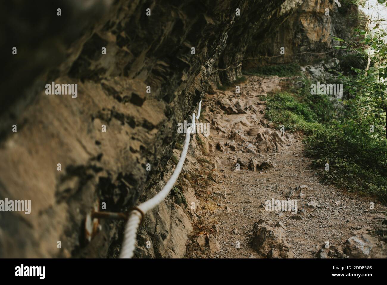 Rope on rock formation at Las Xanas Route Stock Photo - Alamy
