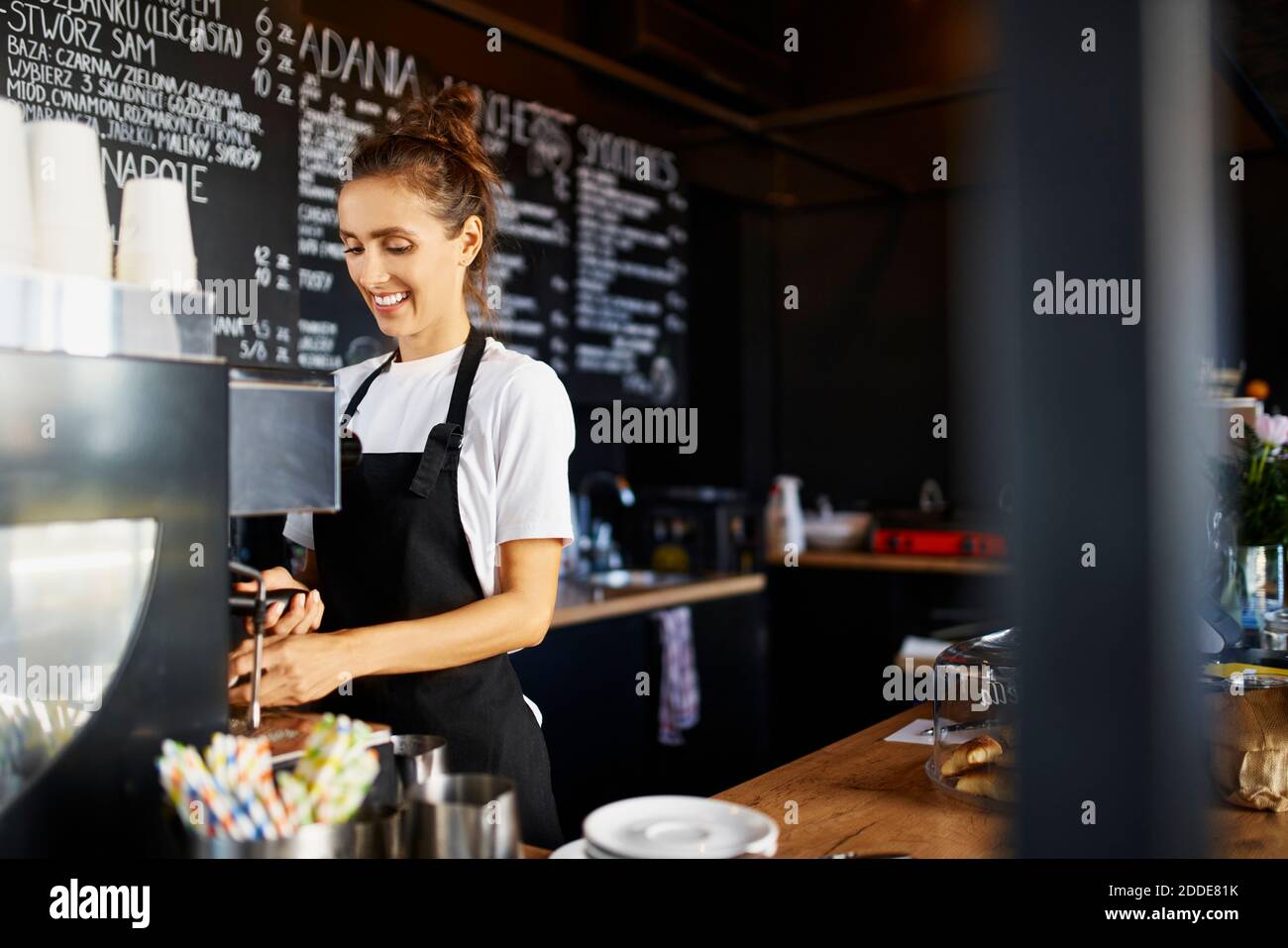 Confident female barista working at cafe Stock Photo - Alamy