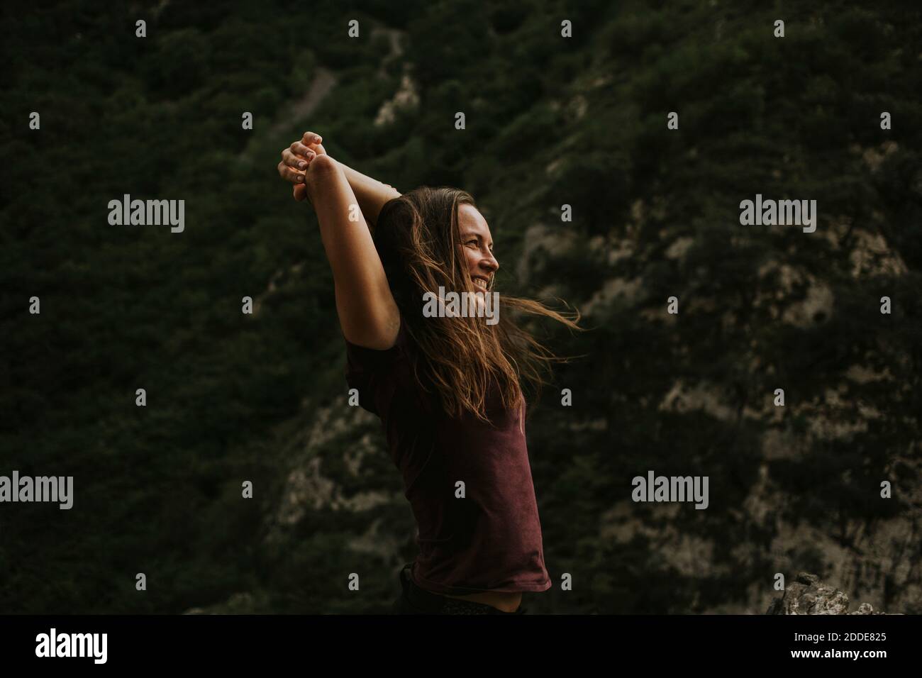 Happy female trekker enjoying while stretching during hiking Stock ...