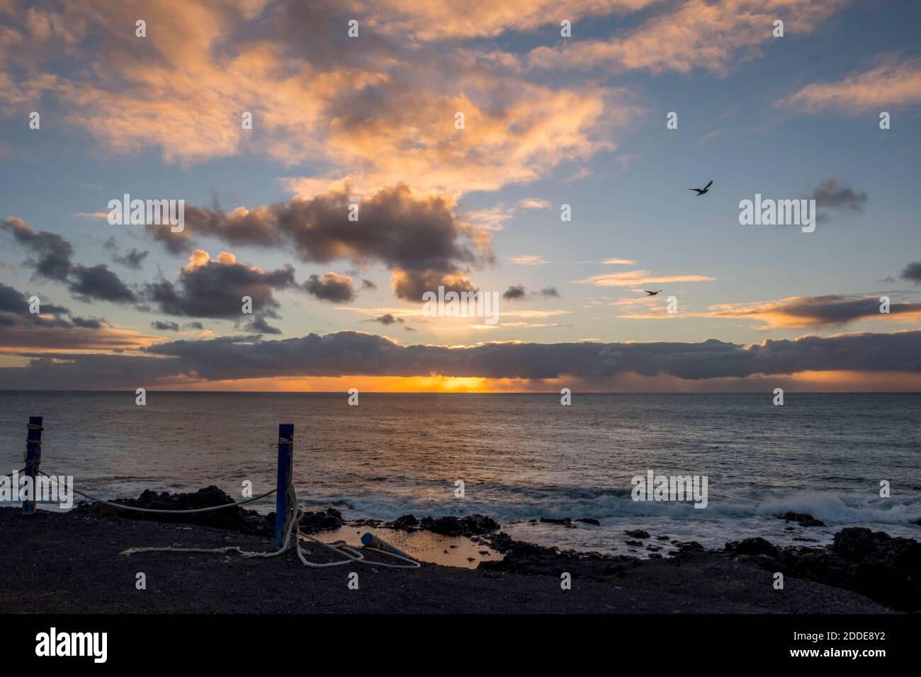 Sunset view at beach Stock Photo - Alamy