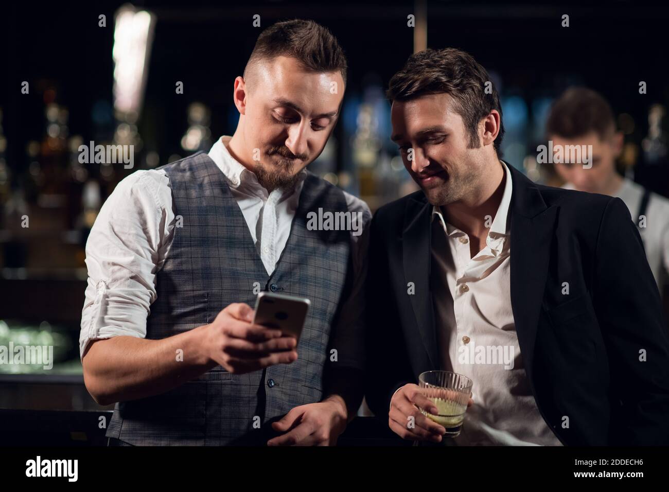 male friends call from a video from a nightclub Stock Photo - Alamy