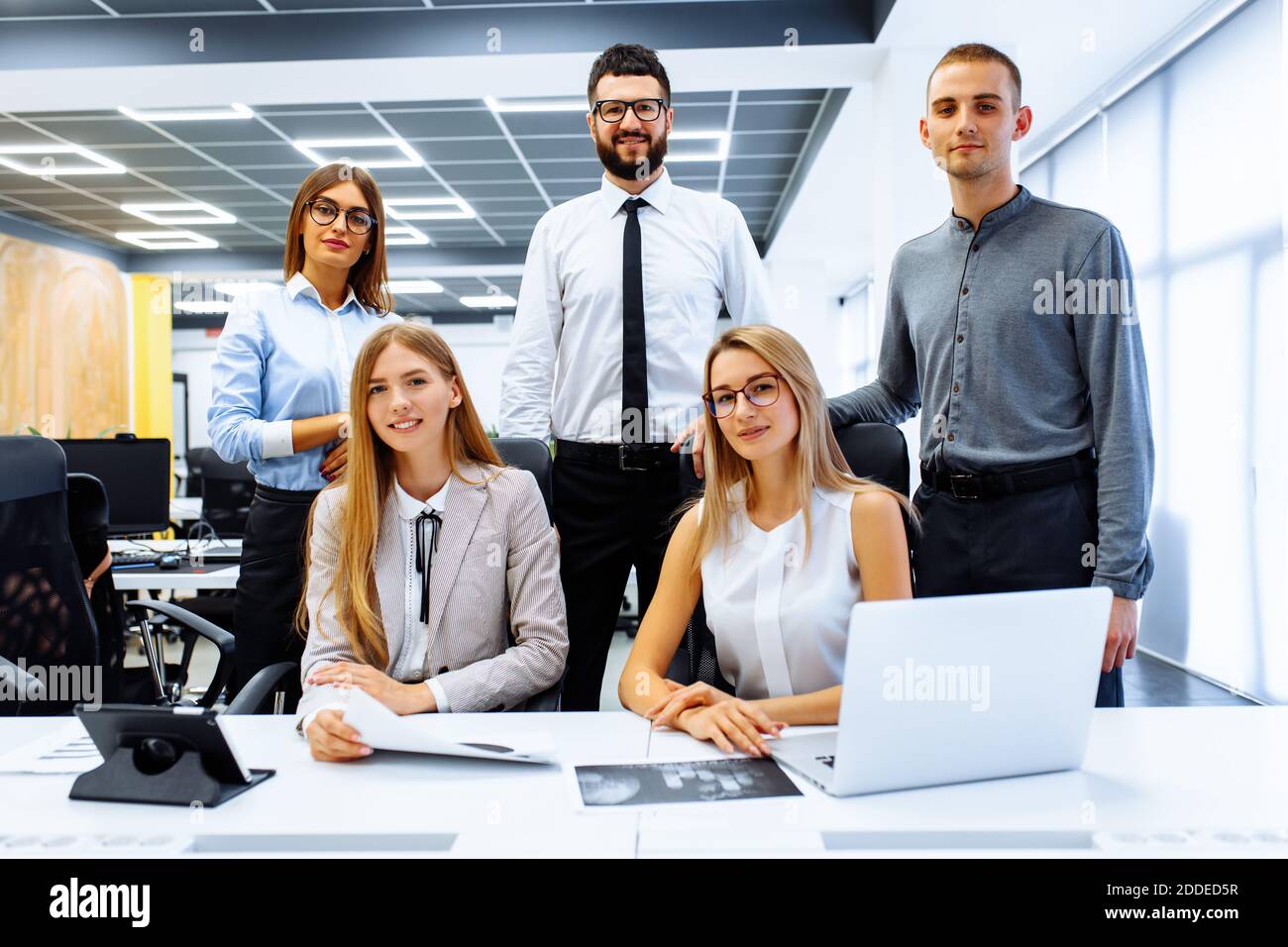 Company employees standing together hi-res stock photography and images ...