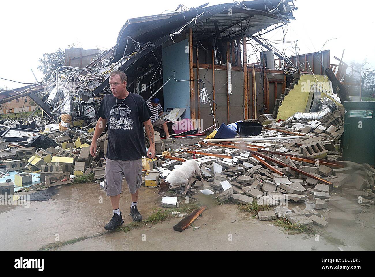 NO FILM, NO VIDEO, NO TV, NO DOCUMENTARY - Brian Bon inspects damages ...