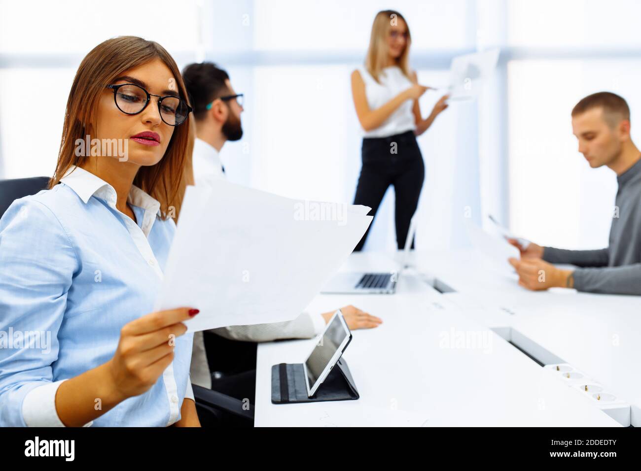 Successful team leader leading business meeting with colleagues ...