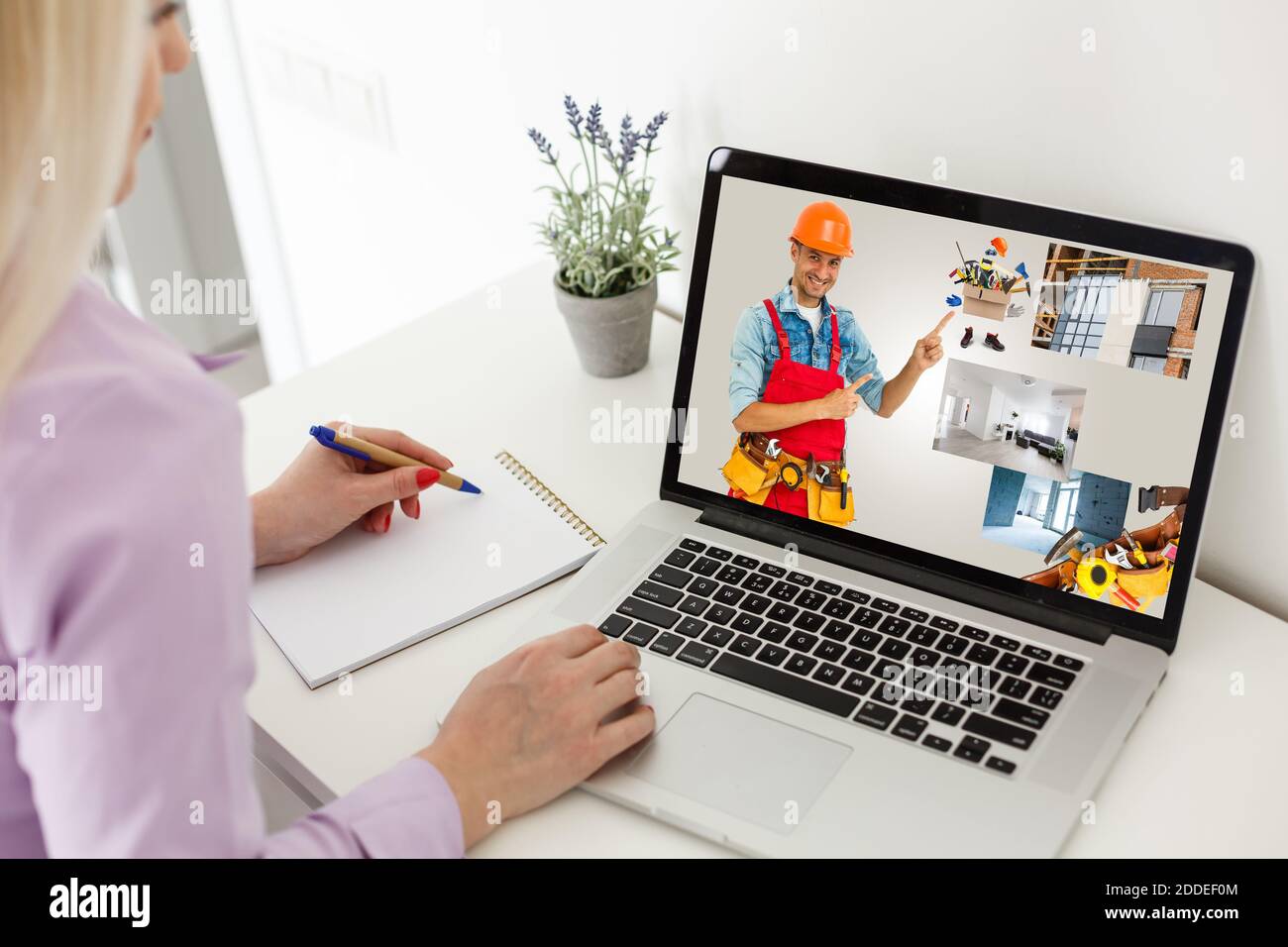 young manual worker displaying laptop over white background Stock Photo ...