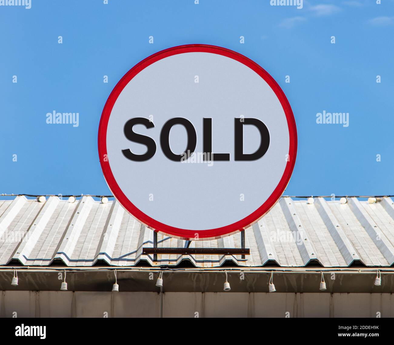 A Circle billboard with text shows SOLD is installed on a roof Stock ...