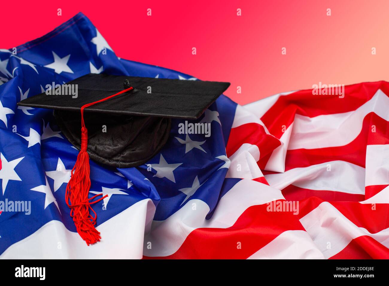 graduation hat on US flag, education concept Stock Photo - Alamy