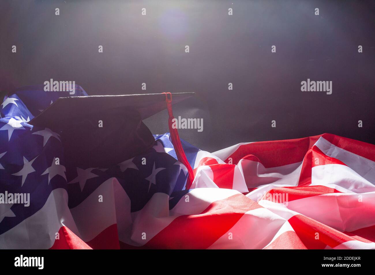 graduation hat on US flag, education concept Stock Photo - Alamy