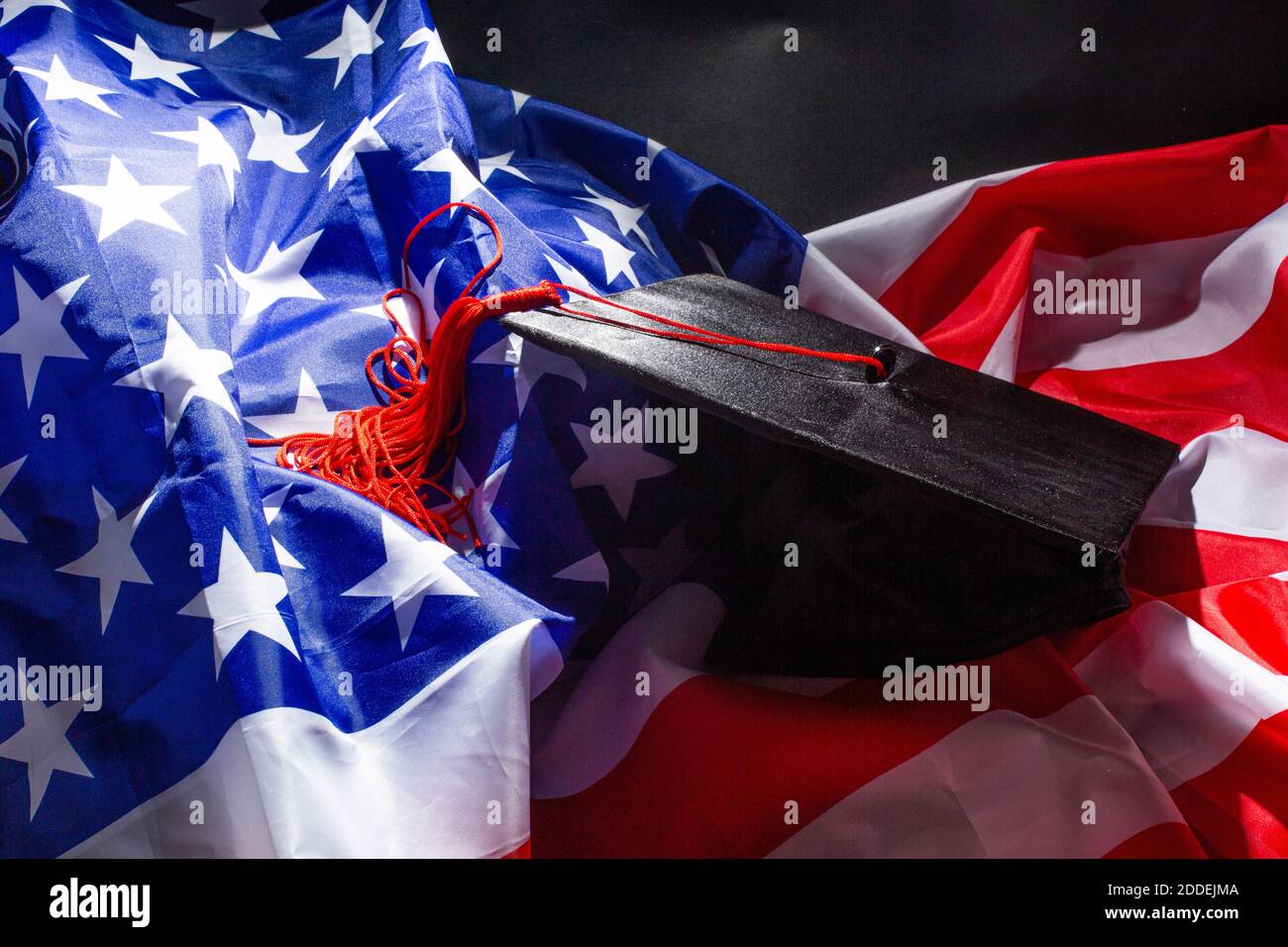graduation hat on US flag, education concept Stock Photo - Alamy