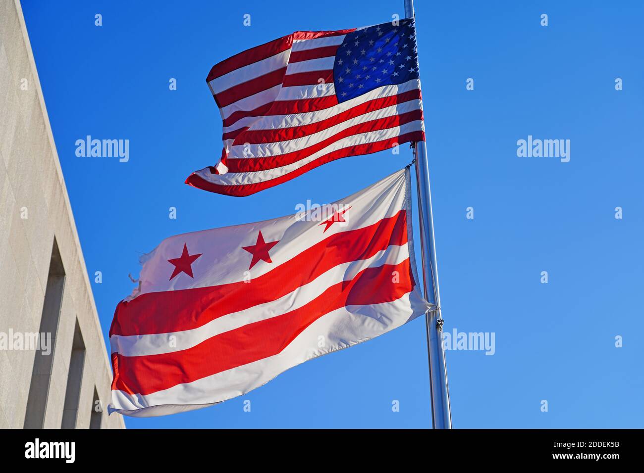 Flags of Washington DC and the United States floating side by side ...