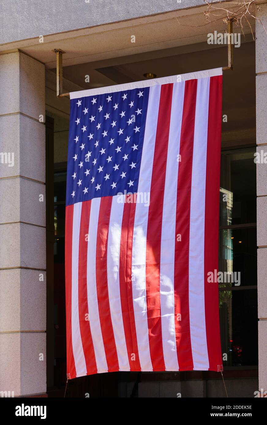 A large American flag hanging vertically in Washington, DC Stock Photo ...