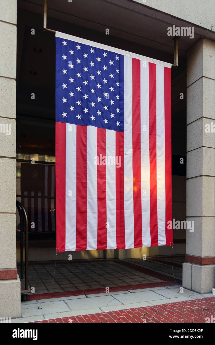 A large American flag hanging vertically in Washington, DC Stock Photo ...
