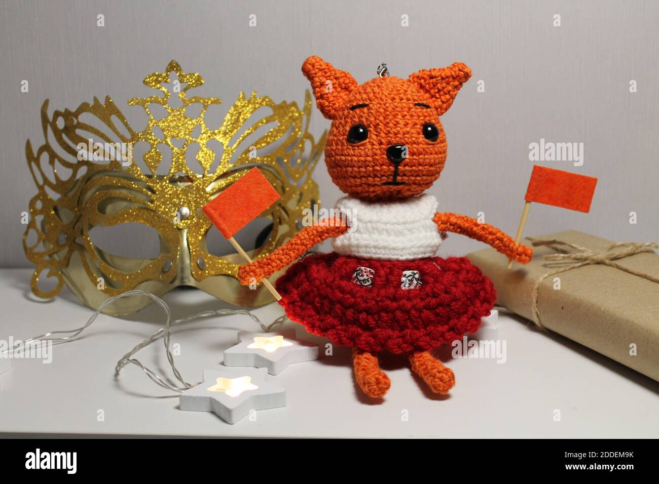 Cute knitted toy squirrel holds flags for inscription Stock Photo - Alamy