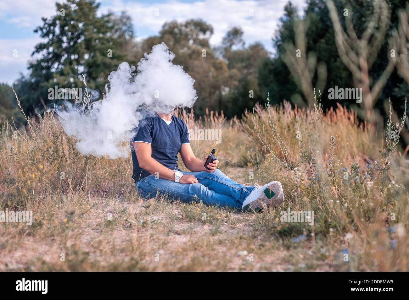 Beardedvaper smoking an electronic cigarette outdoorr. Electronic ...