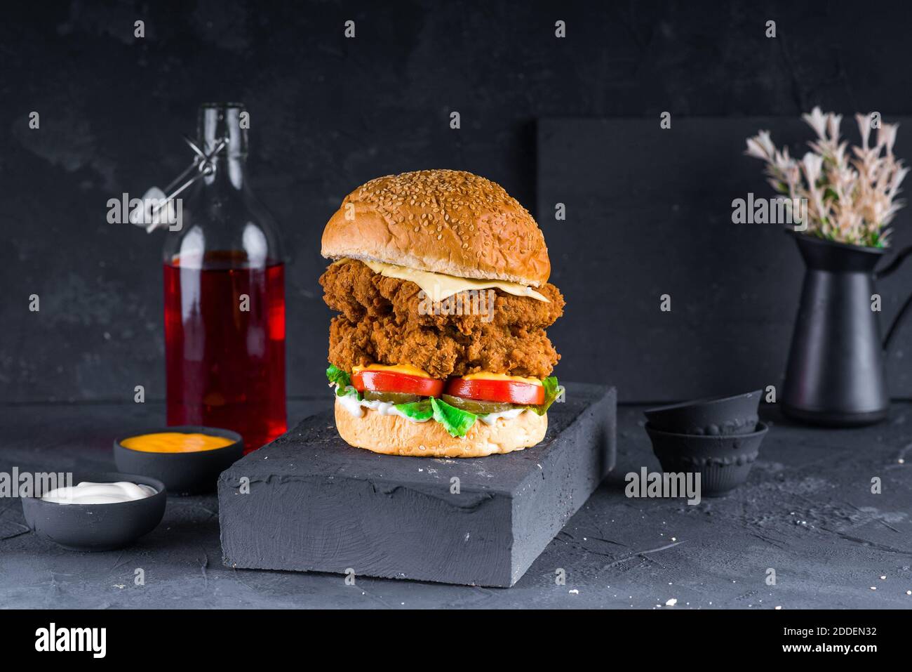 chicken burger with cheese and sauce Stock Photo - Alamy