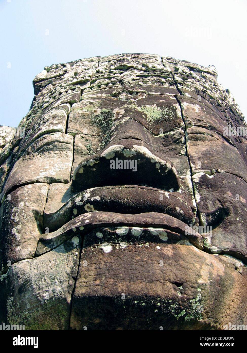 Large detailed stone carved face in Bayon, Cambodia, is part of Angkor ...