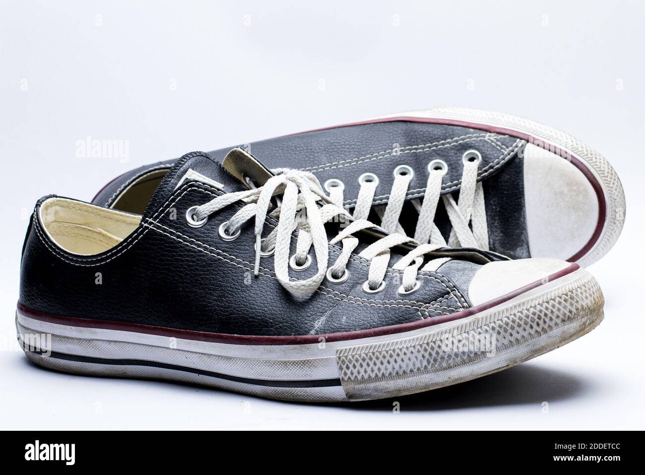 Old dirty sneakers worn out by years of use Stock Photo - Alamy