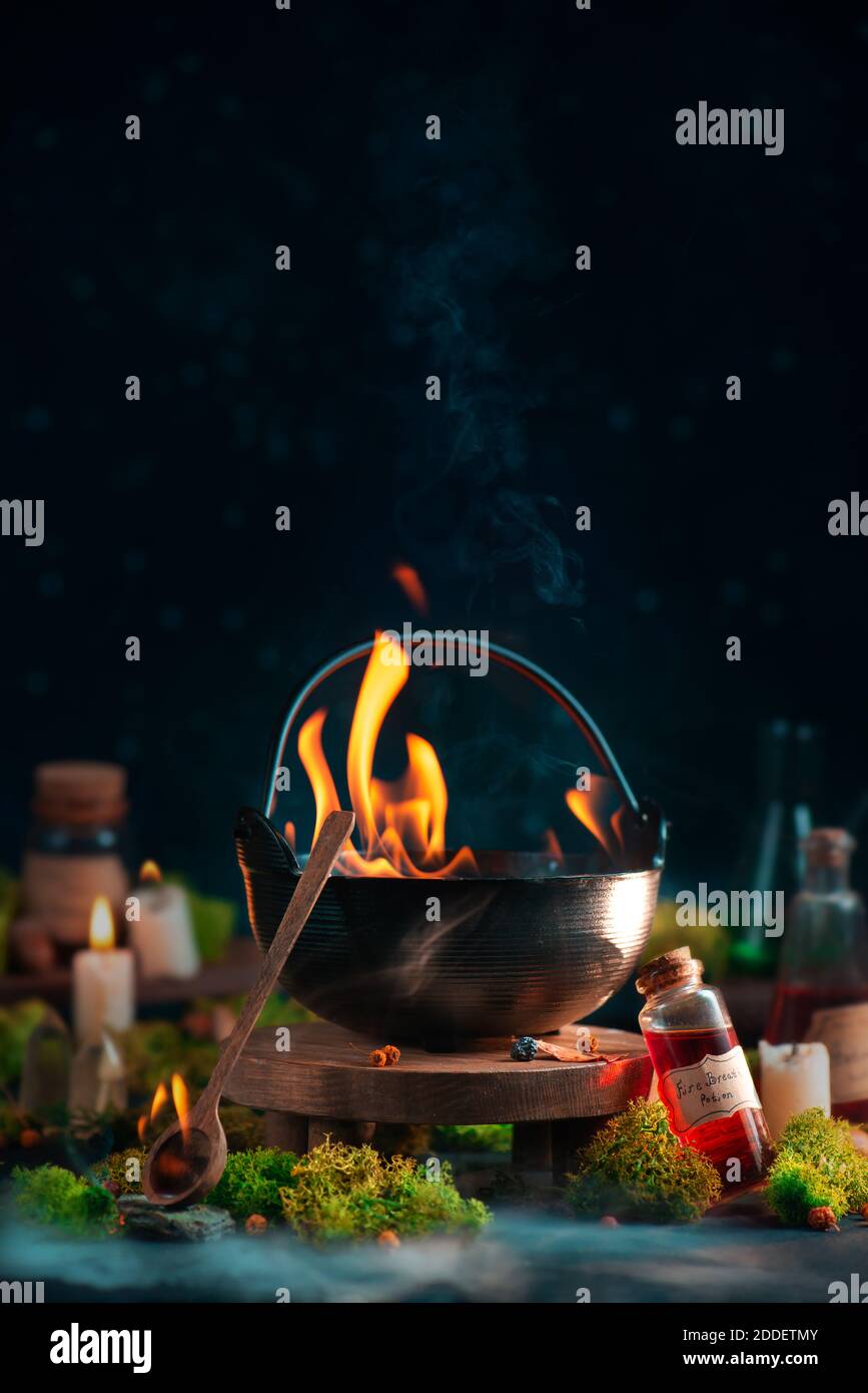 Fire breath potion bottle with cauldron, flames, and moss on a witch ...