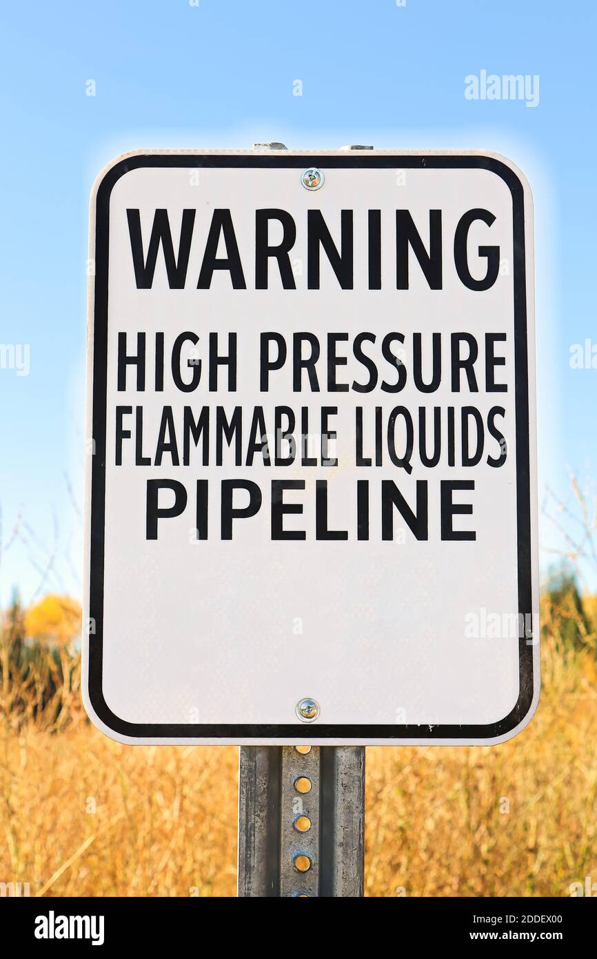 A Warning High Pressure Pipeline Flammable Liquids sign Stock Photo - Alamy