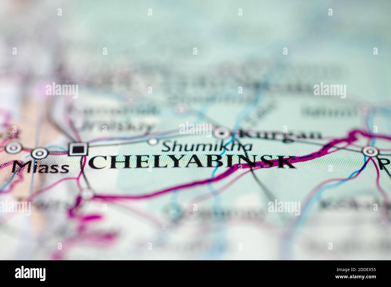 Shallow depth of field focus on geographical map location of ...