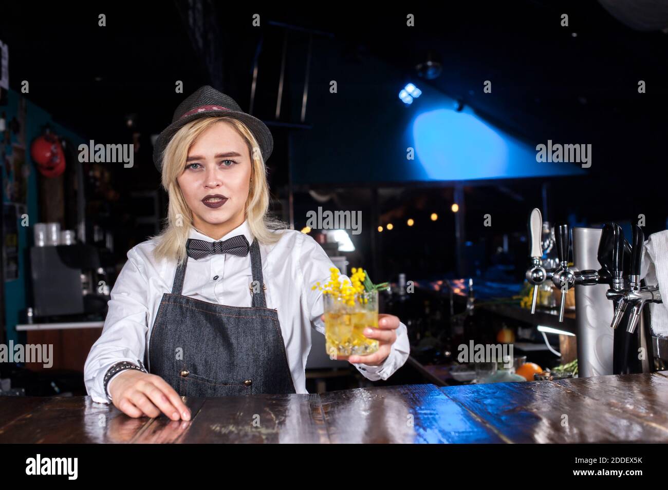 Sweet woman barkeeper surprises with its skill bar visitors in pub Stock Photo - Alamy