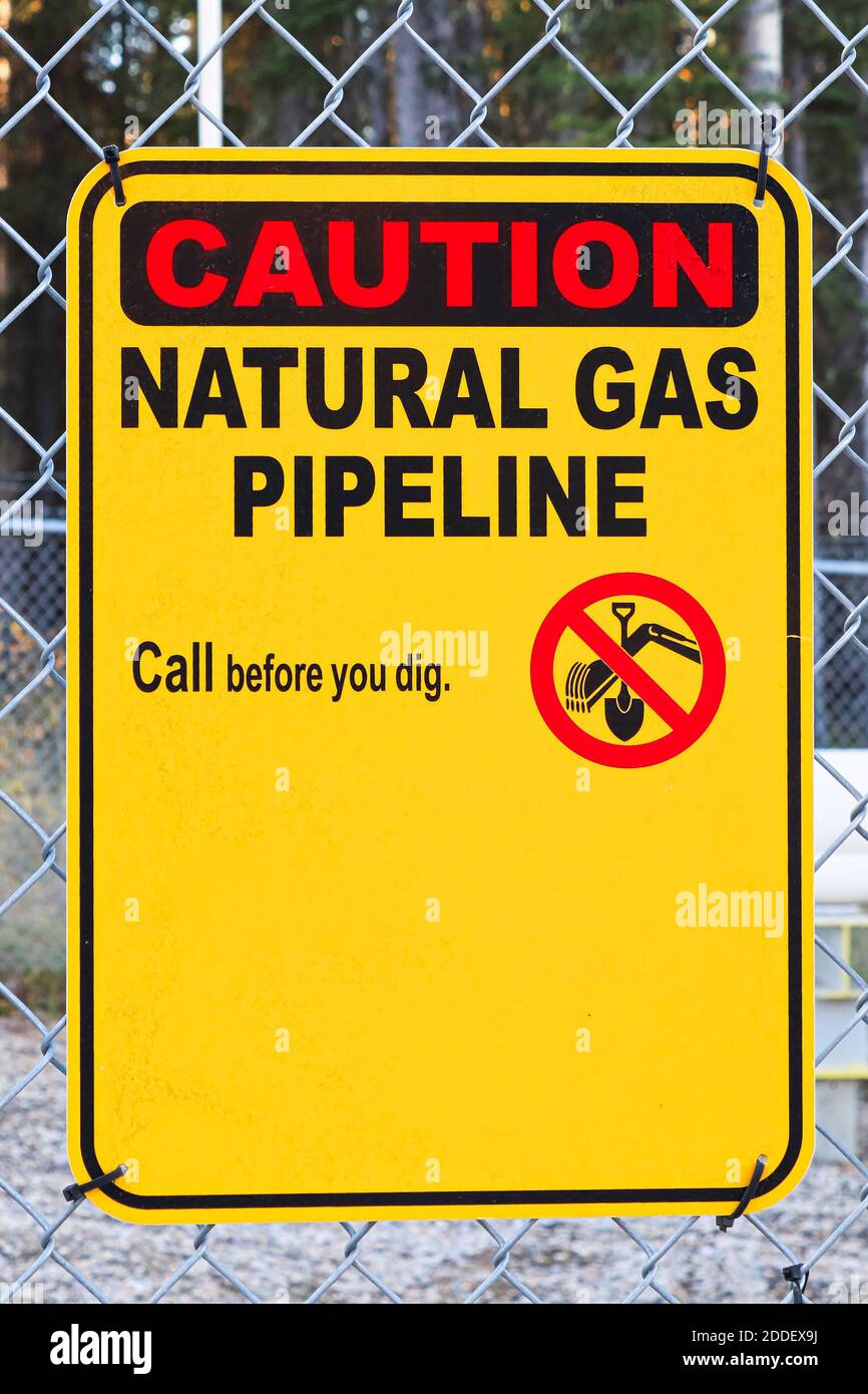 Closeup of a Caution Natural Gas Pipeline sign Stock Photo - Alamy
