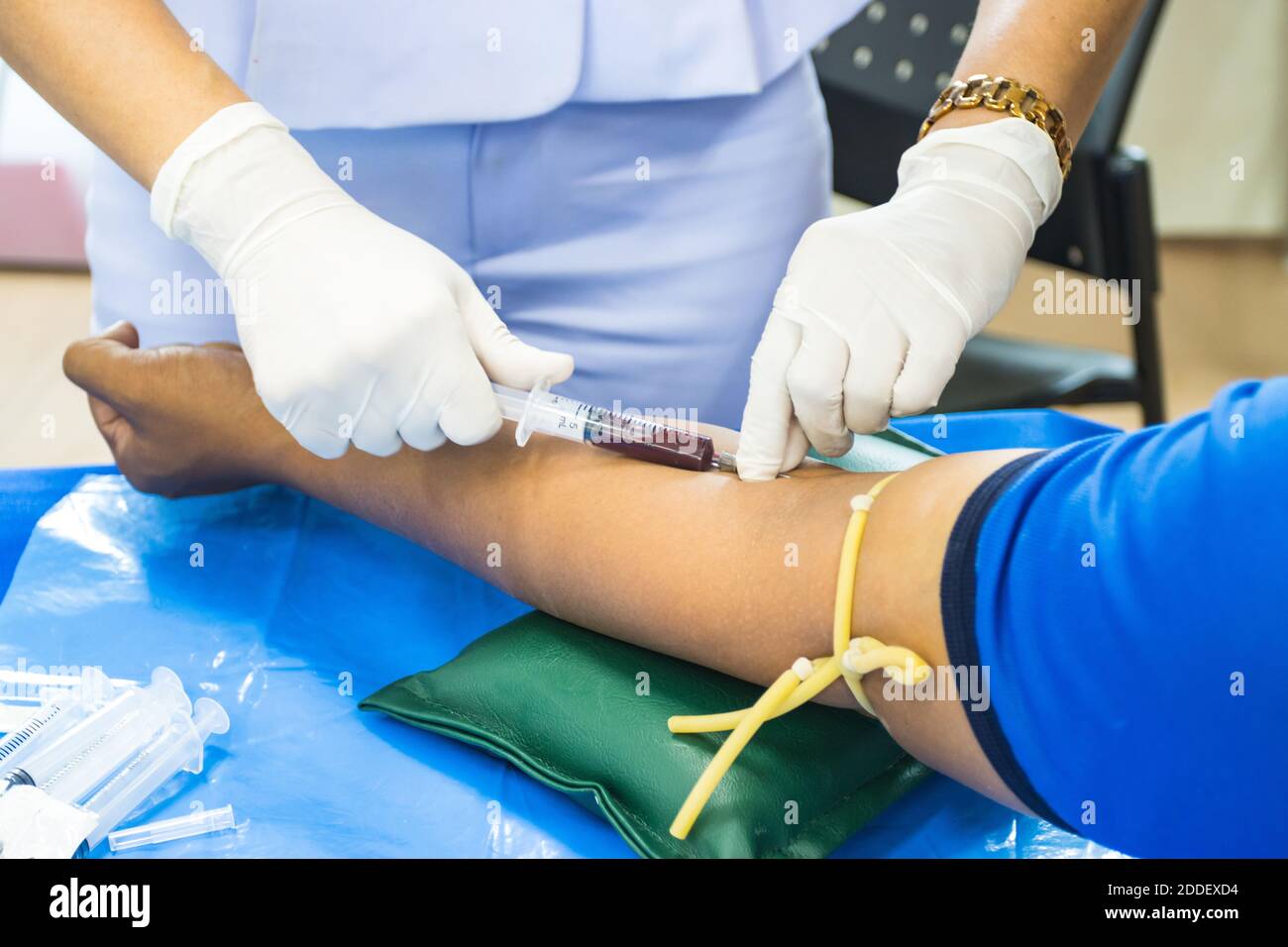doctor injection needle on arm to collect blood for test the health ...